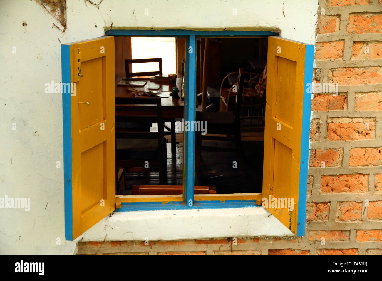 Looking inside a very colorful blue and yellow window built into the ...