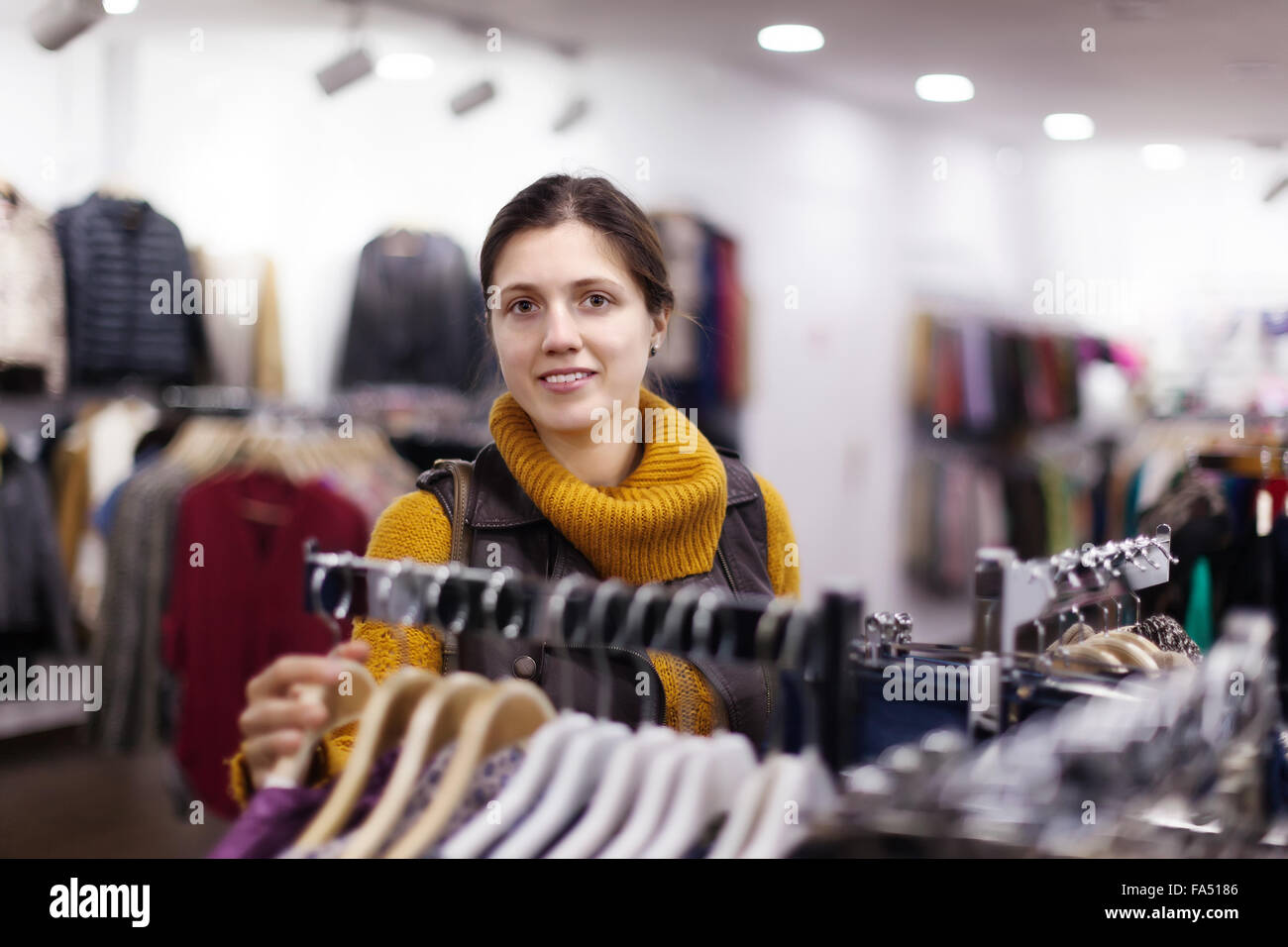 Ordinary woman at clothing store Stock Photo - Alamy