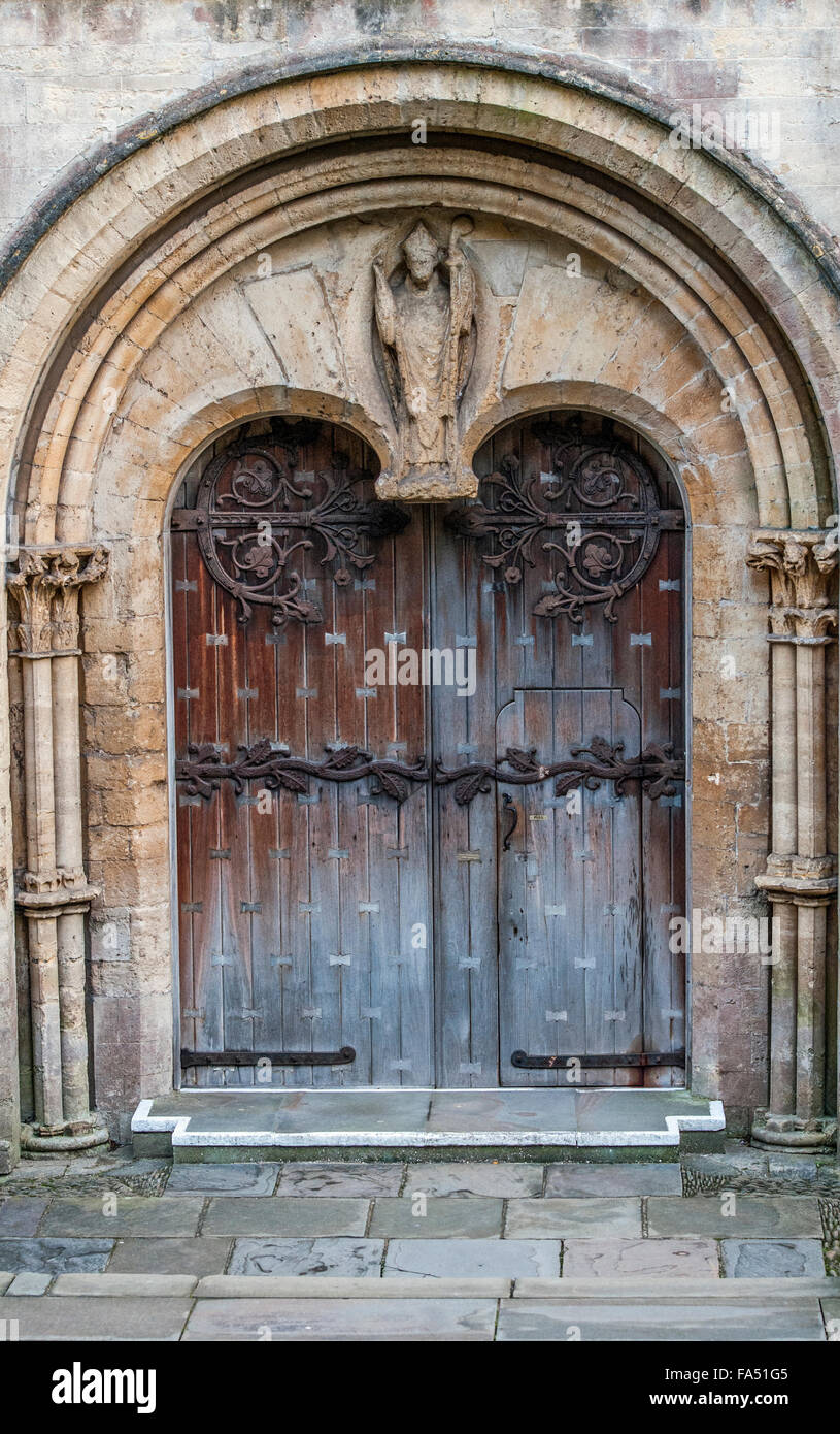Llandaff Cathedral Cardiff showing the west door and a carving of St ...