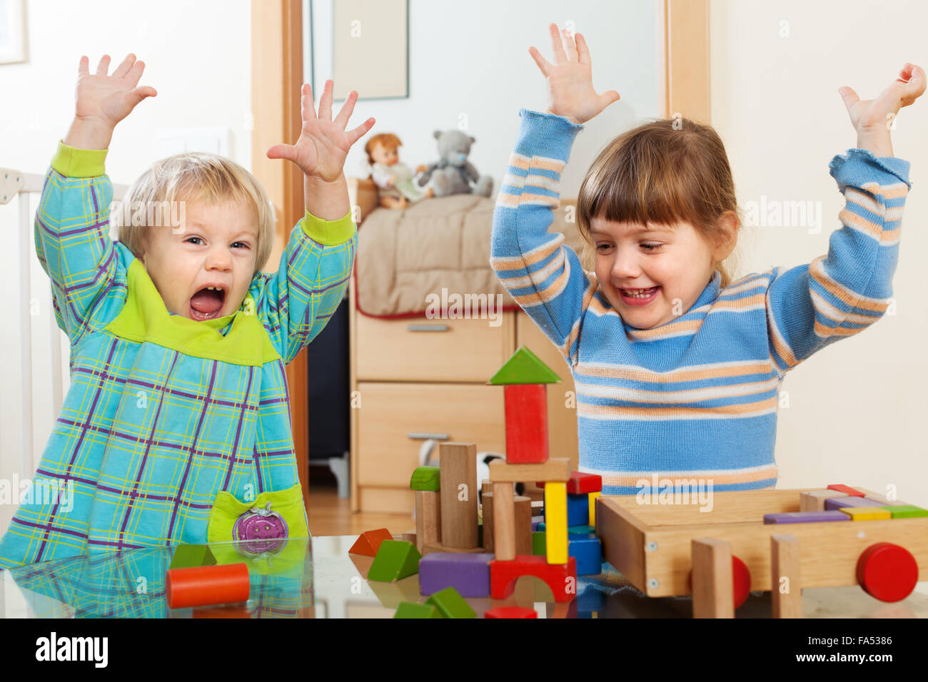 Emotional happy children in home Stock Photo - Alamy