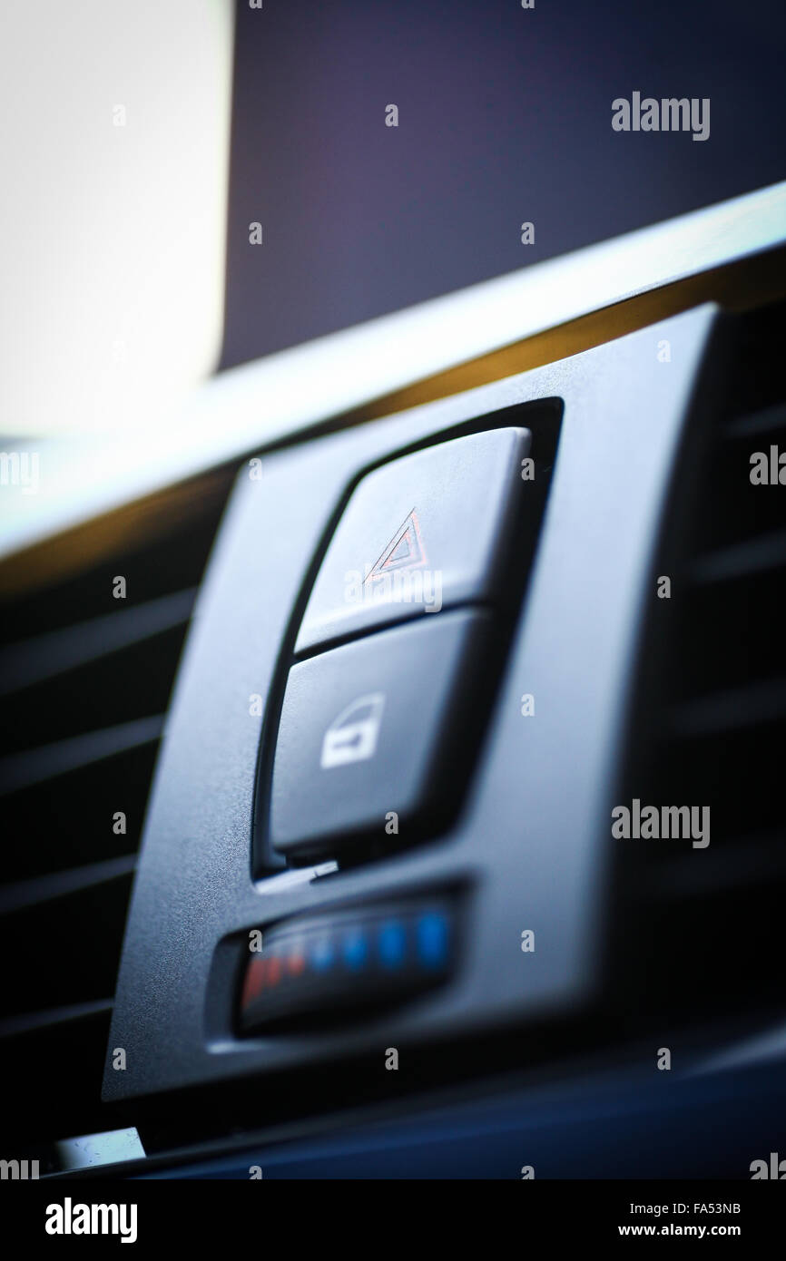 Detail of a warning button in a car Stock Photo - Alamy
