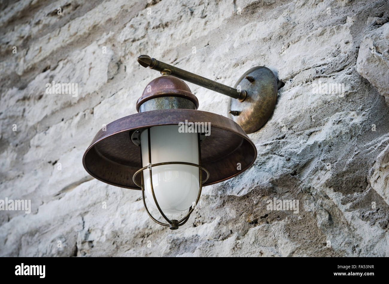 Antique street lamp on a stone wall hi-res stock photography and images ...