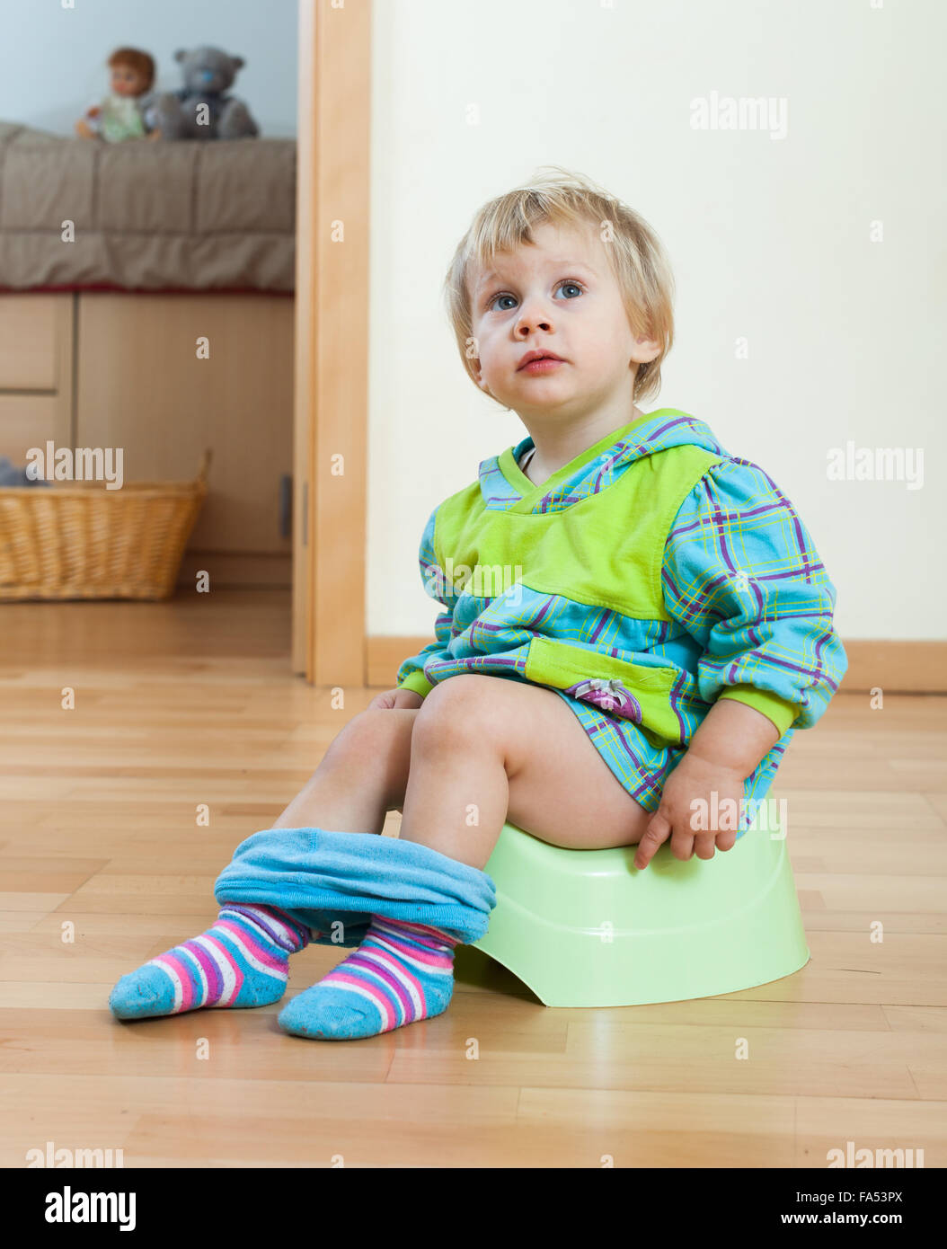 girl sitting on potty in home interior Stock Photo - Alamy