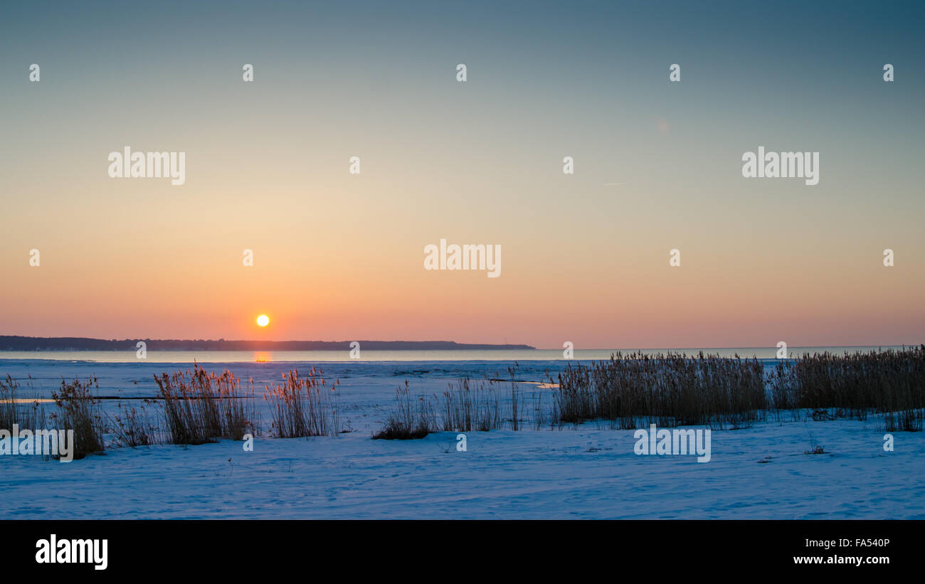 Winter sunset on the sea Stock Photo - Alamy