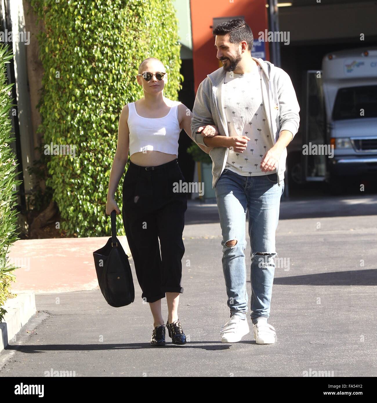 Rose McGowan sports a newly shaven head while out with her husband ...