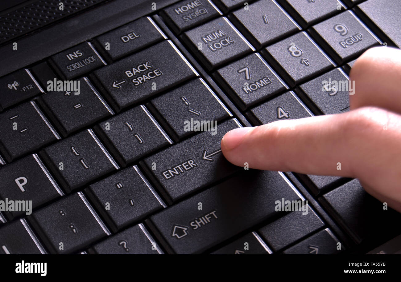 Pressing enter on laptop hi-res stock photography and images - Alamy