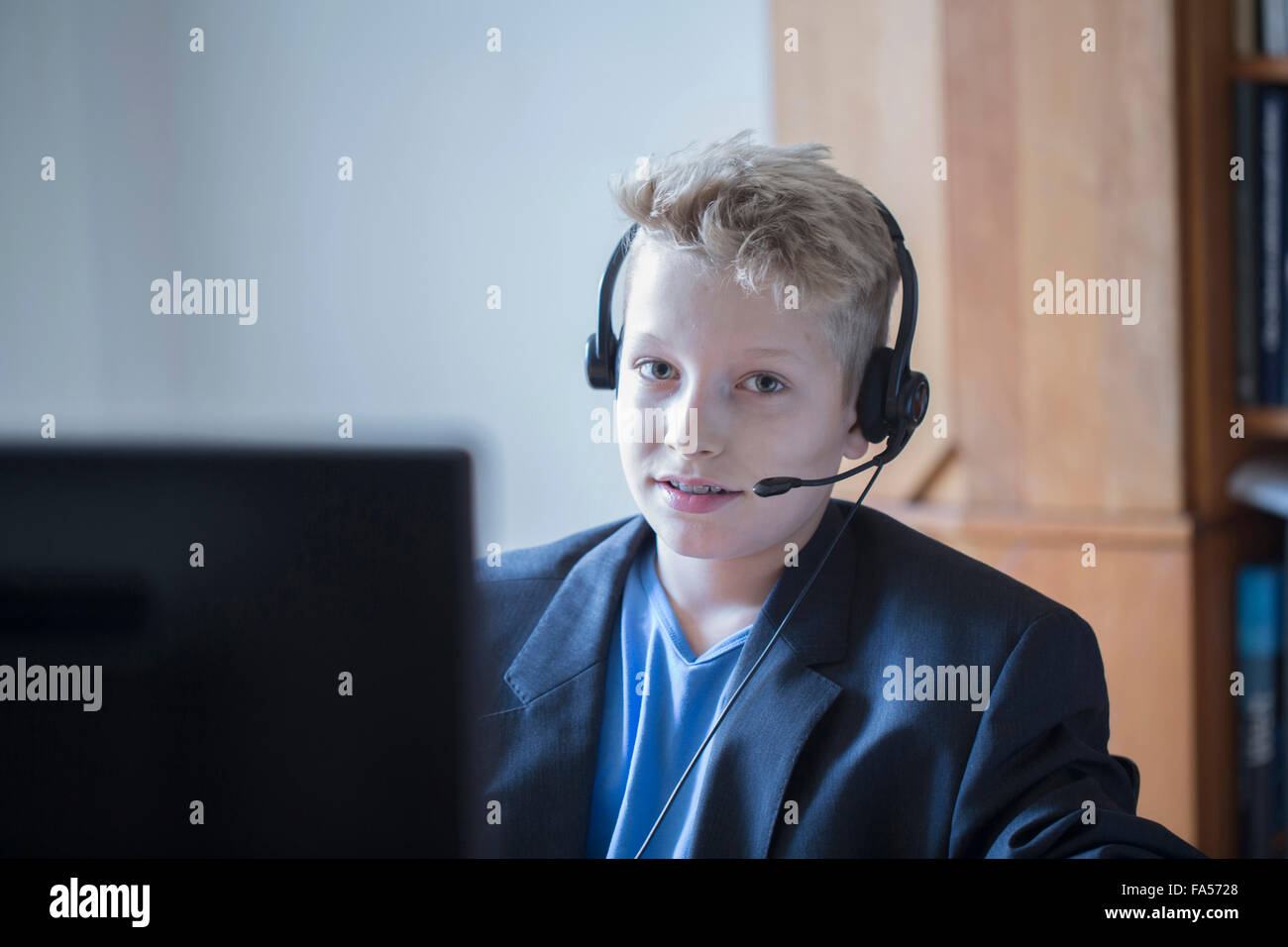 Boy with telephone headset hi-res stock photography and images - Alamy