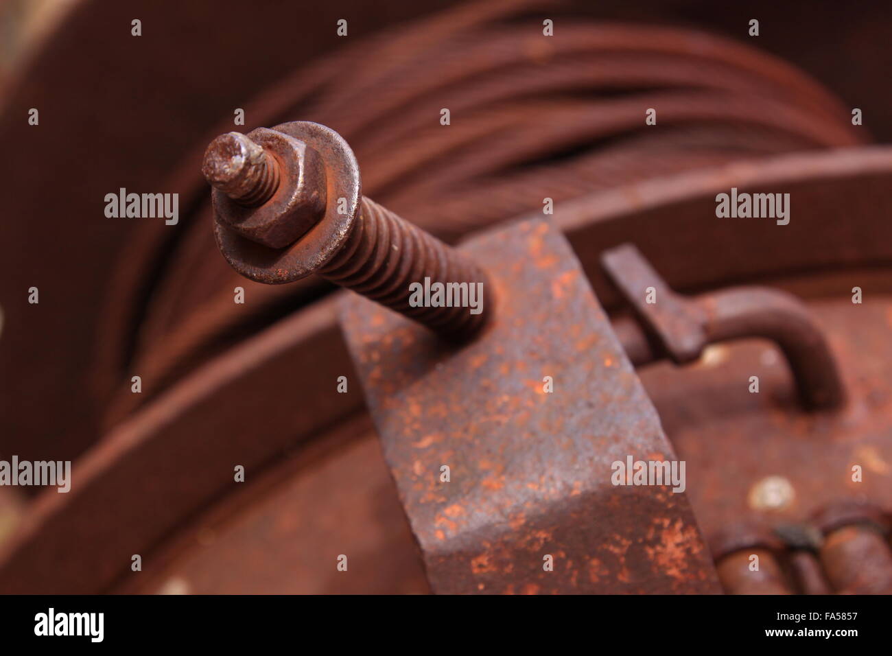 Closeup of a screw and steel cable wrapped in a roll Stock Photo - Alamy