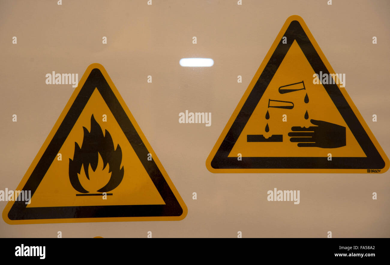 yellow warning signs in science classroom at highschool Stock Photo - Alamy