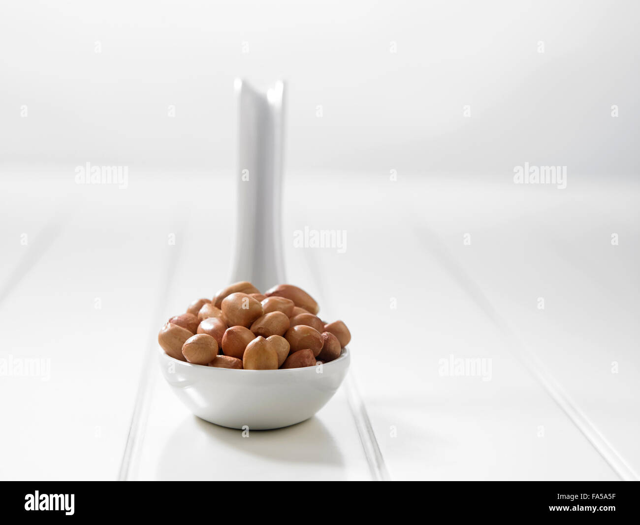 spoon full of ground nuts Stock Photo - Alamy