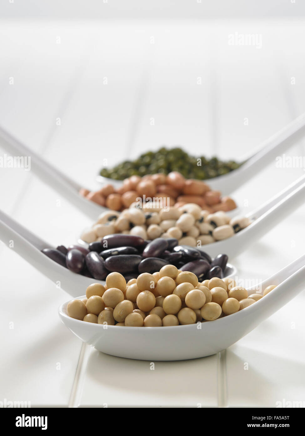 variety of beans group in five spoons Stock Photo - Alamy