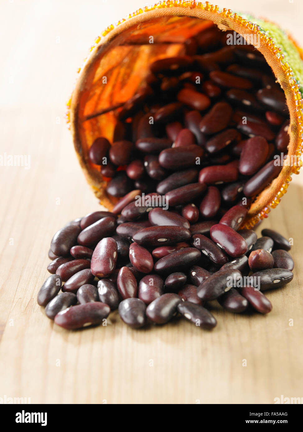 red kidney beans pouring out from container Stock Photo - Alamy