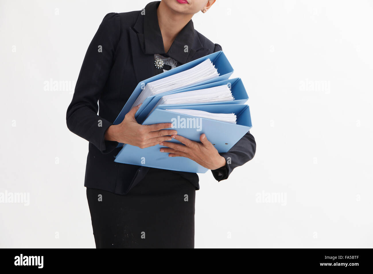 mid section on businesswoman carrying a stack of file Stock Photo - Alamy