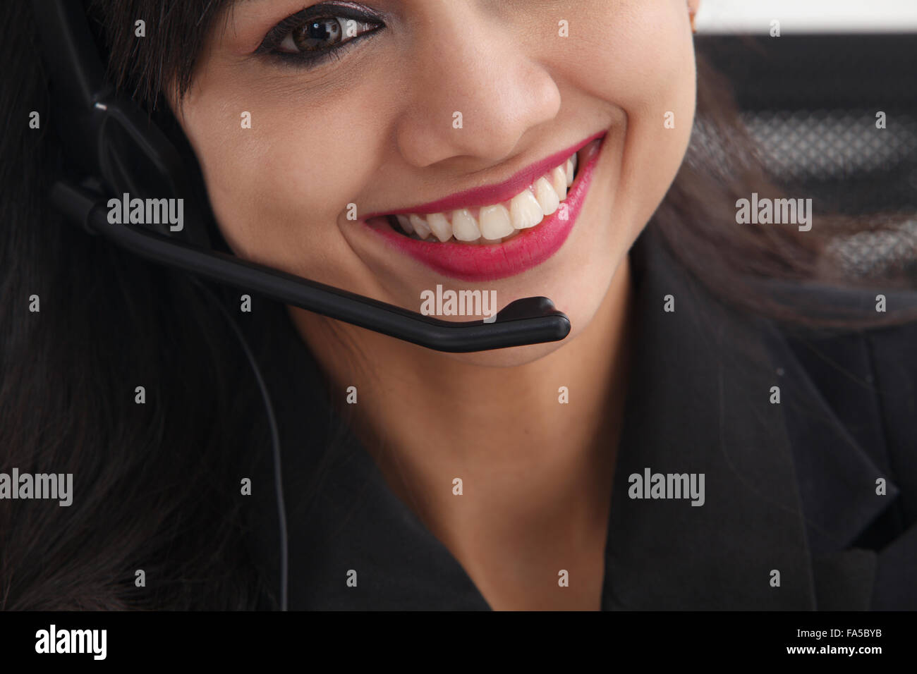 close up at the teeth of receptionist talking Stock Photo - Alamy