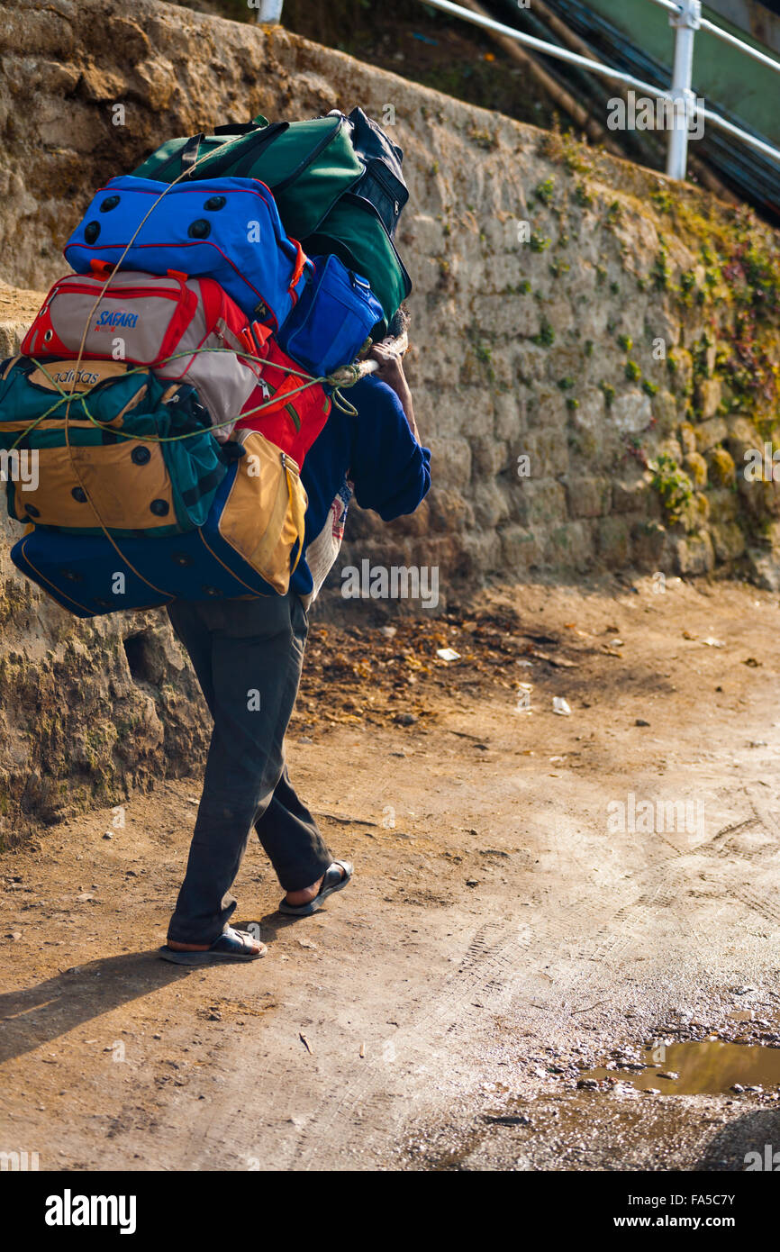 Indian man carrying many heavy hi-res stock photography and images - Alamy