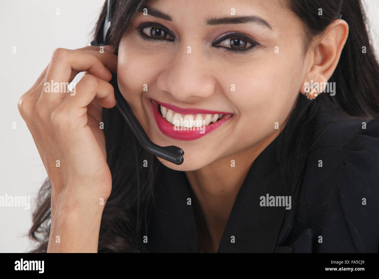Side view of beautiful receptionist wearing head set talking Stock ...