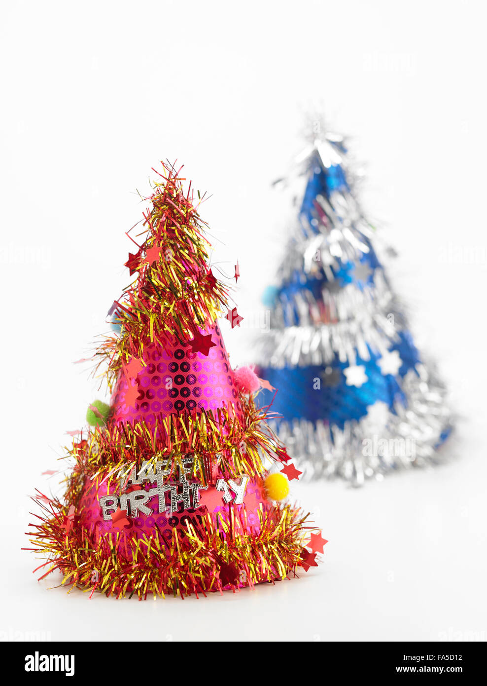 color party hat on the background Stock Photo - Alamy