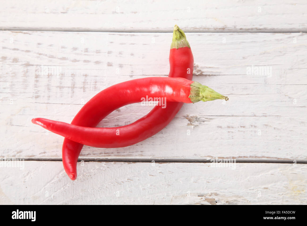 two red chili side by side Stock Photo - Alamy