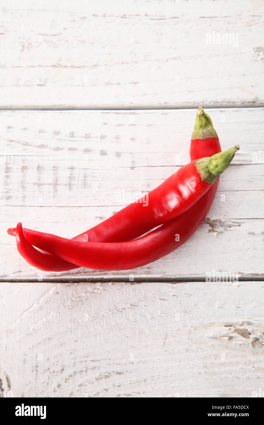 two red chili side by side Stock Photo - Alamy