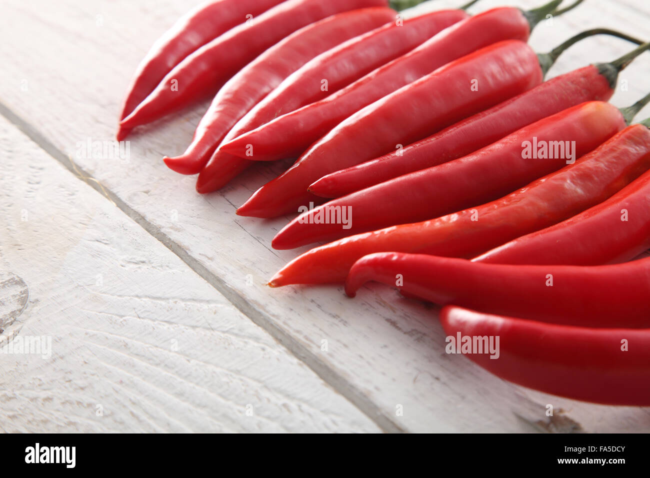 red chilli arrange in a line Stock Photo - Alamy