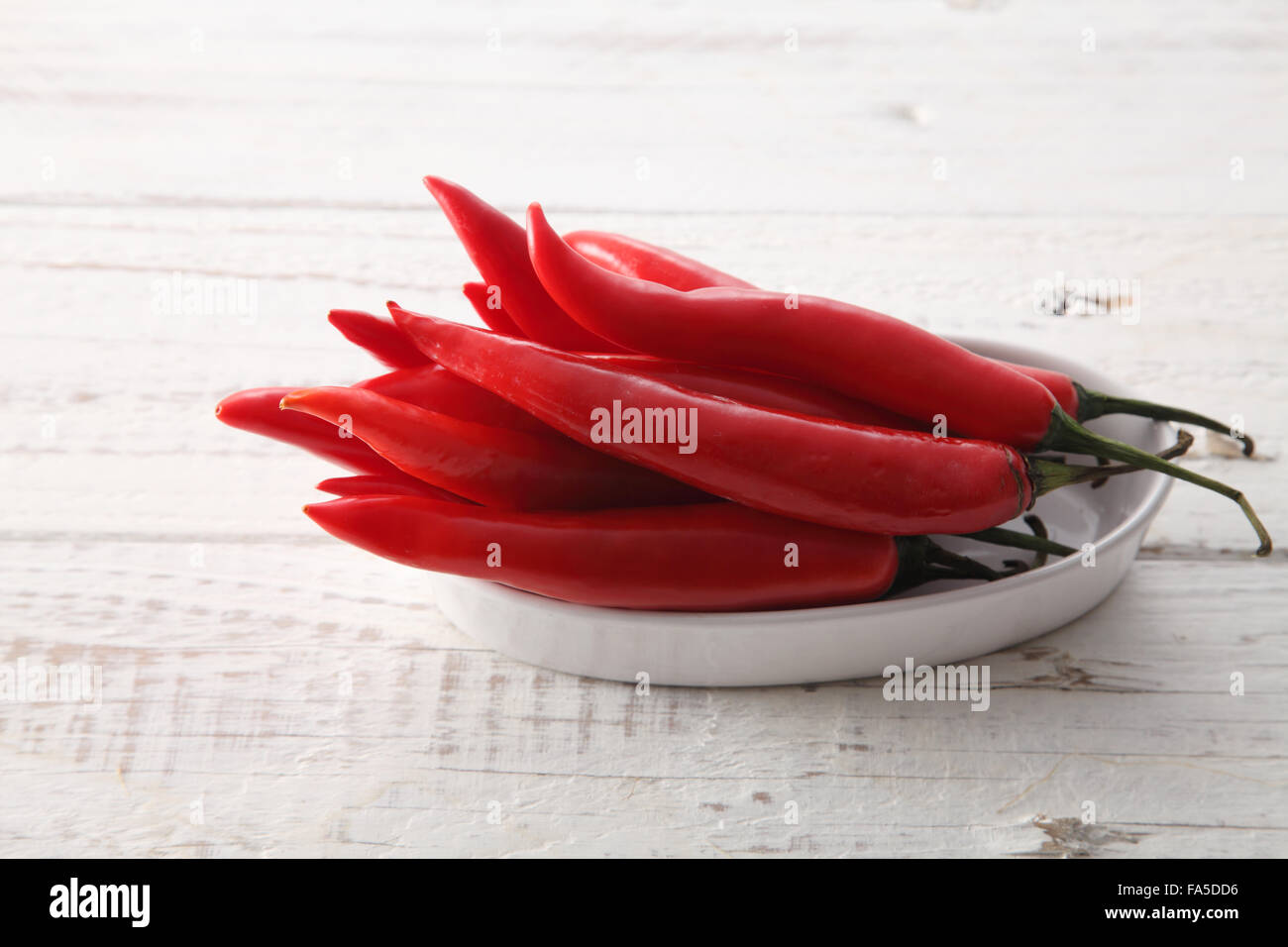 red chili arraged in a small plate Stock Photo - Alamy