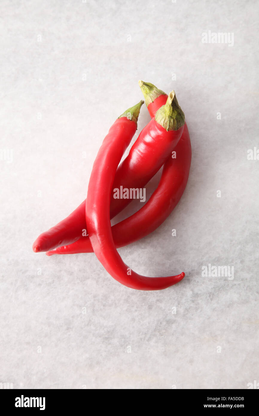 two red chili side by side Stock Photo - Alamy