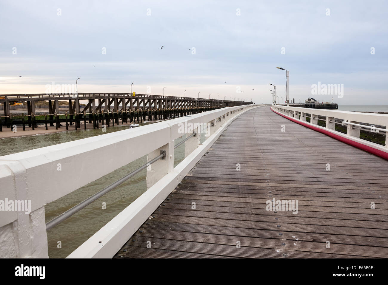 The pier that reaches deep into the sea Stock Photo - Alamy