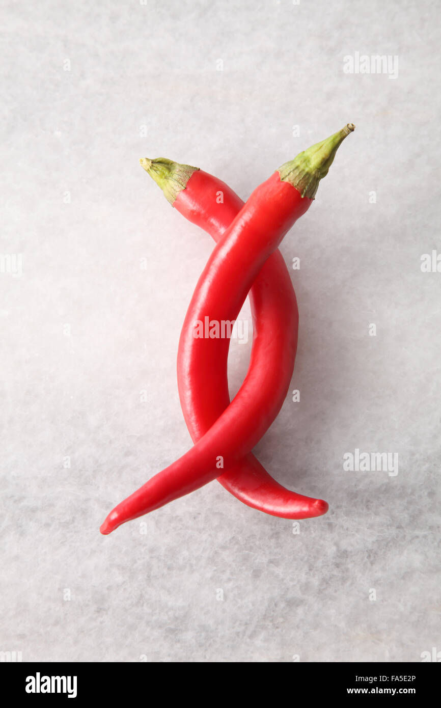 two red chili side by side Stock Photo - Alamy