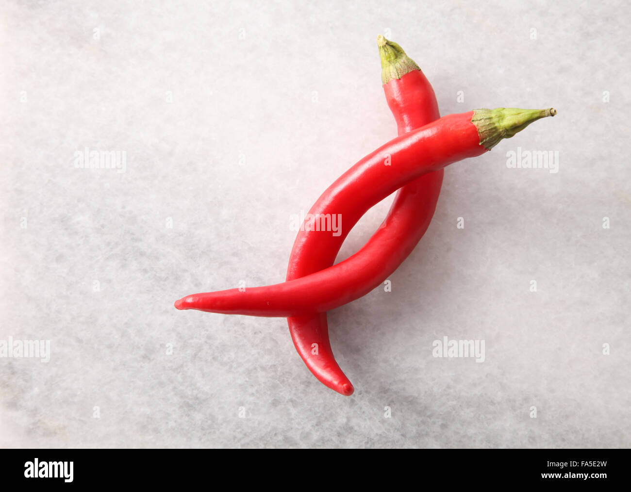 two red chili side by side Stock Photo - Alamy