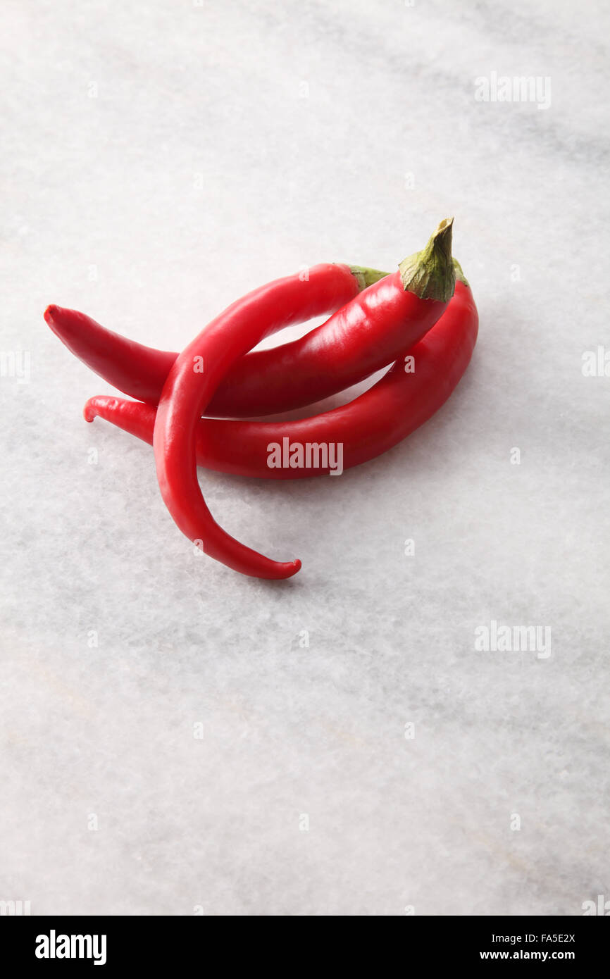 two red chili side by side Stock Photo - Alamy