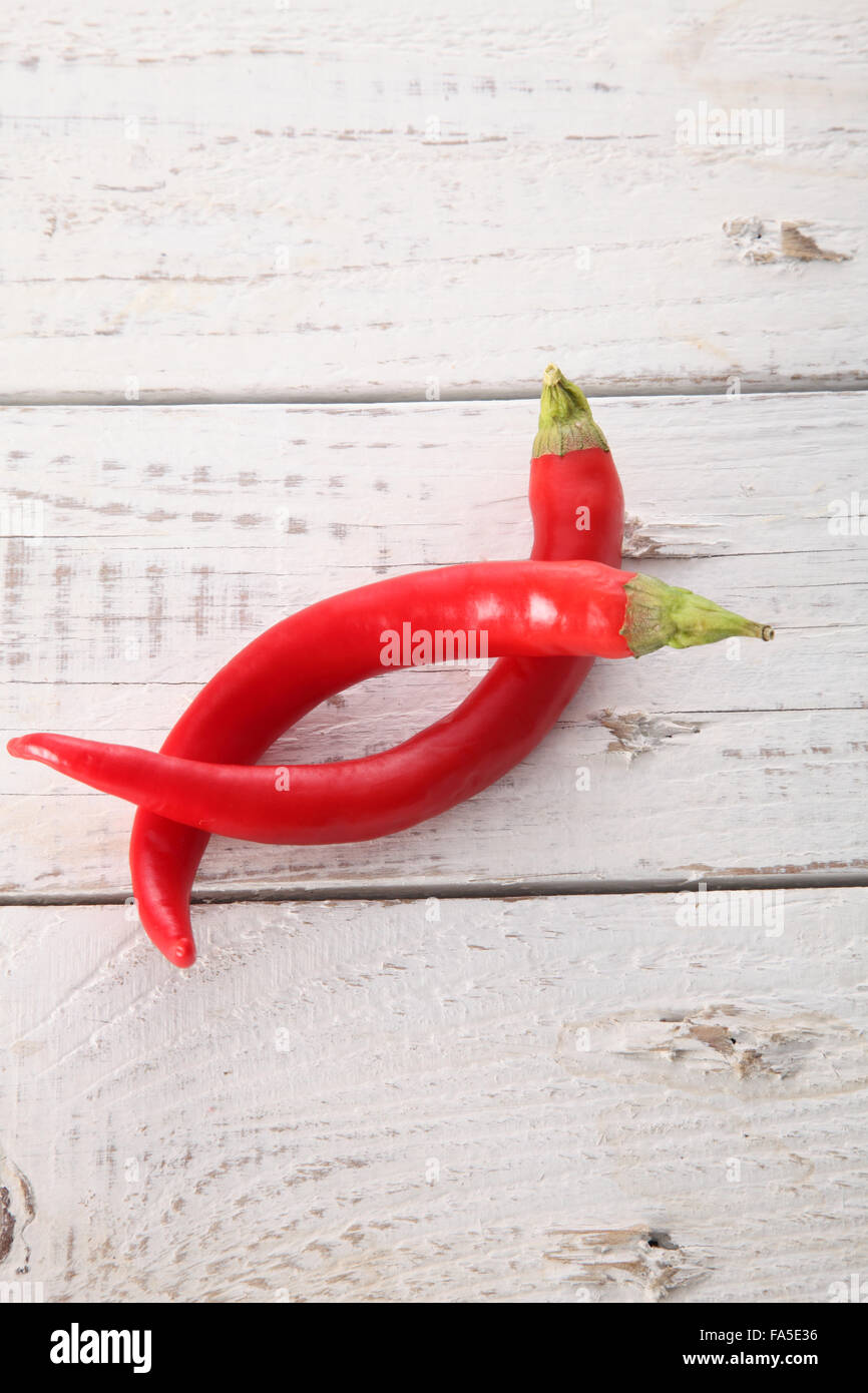 two red chili side by side Stock Photo - Alamy