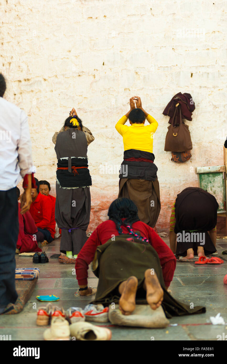 Backs and rear view of women with legs bound and tied with rope ...