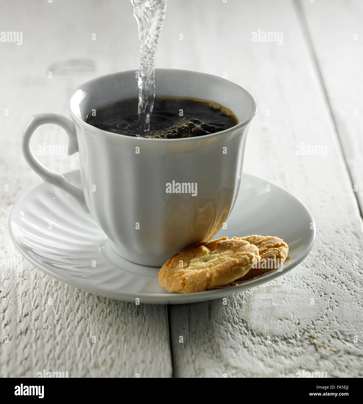 Pouring hot water making cup of coffee Stock Photo - Alamy
