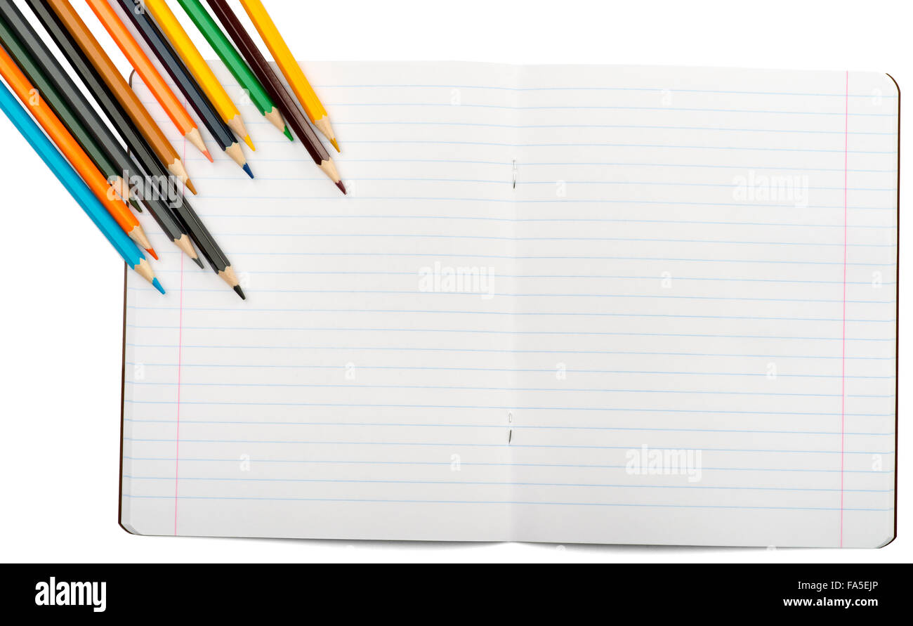 Open notebook with set of crayons Stock Photo - Alamy