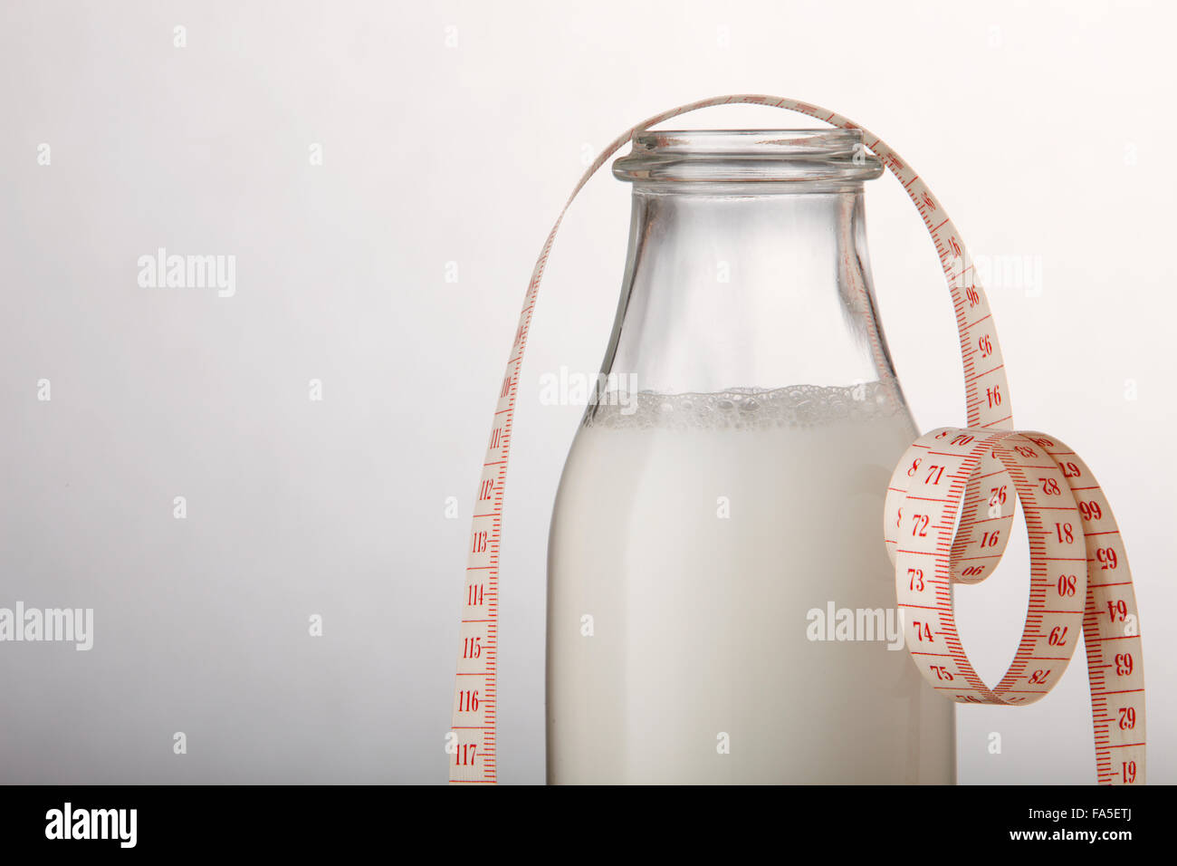 fresh milk and measuring tape Stock Photo - Alamy