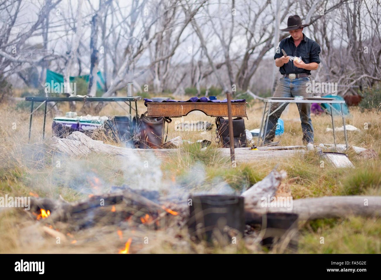 Clay Baird of Bogong Horseback Adventures prepares dinner at camp in ...