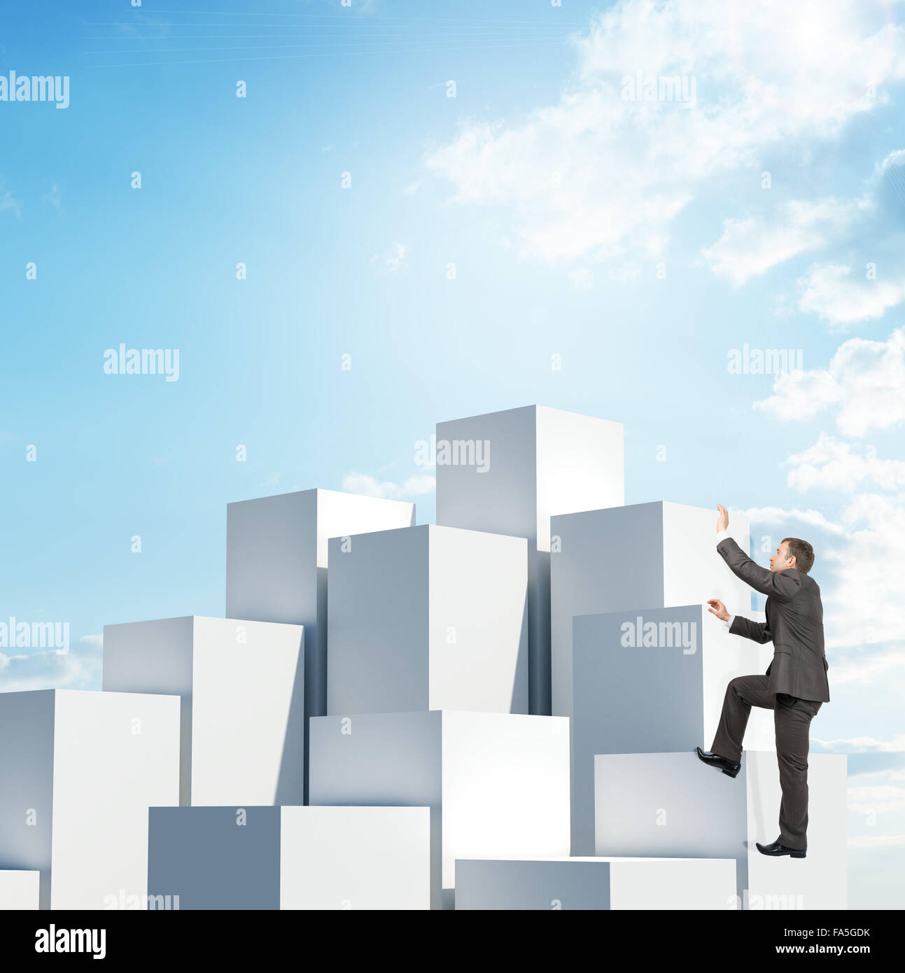 Businessman climbing boxes pile Stock Photo - Alamy