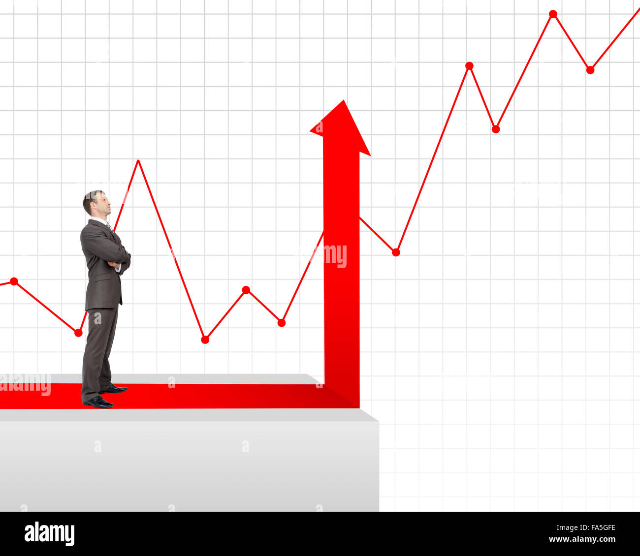 Important-looking businessman on edge of chart Stock Photo - Alamy
