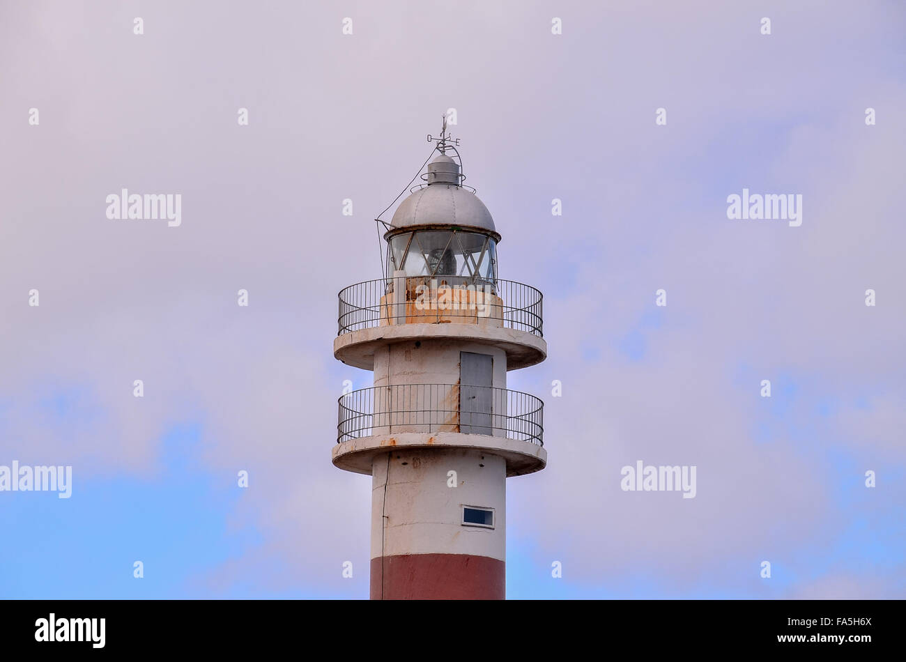 High Lighthouse near the Coast Stock Photo - Alamy
