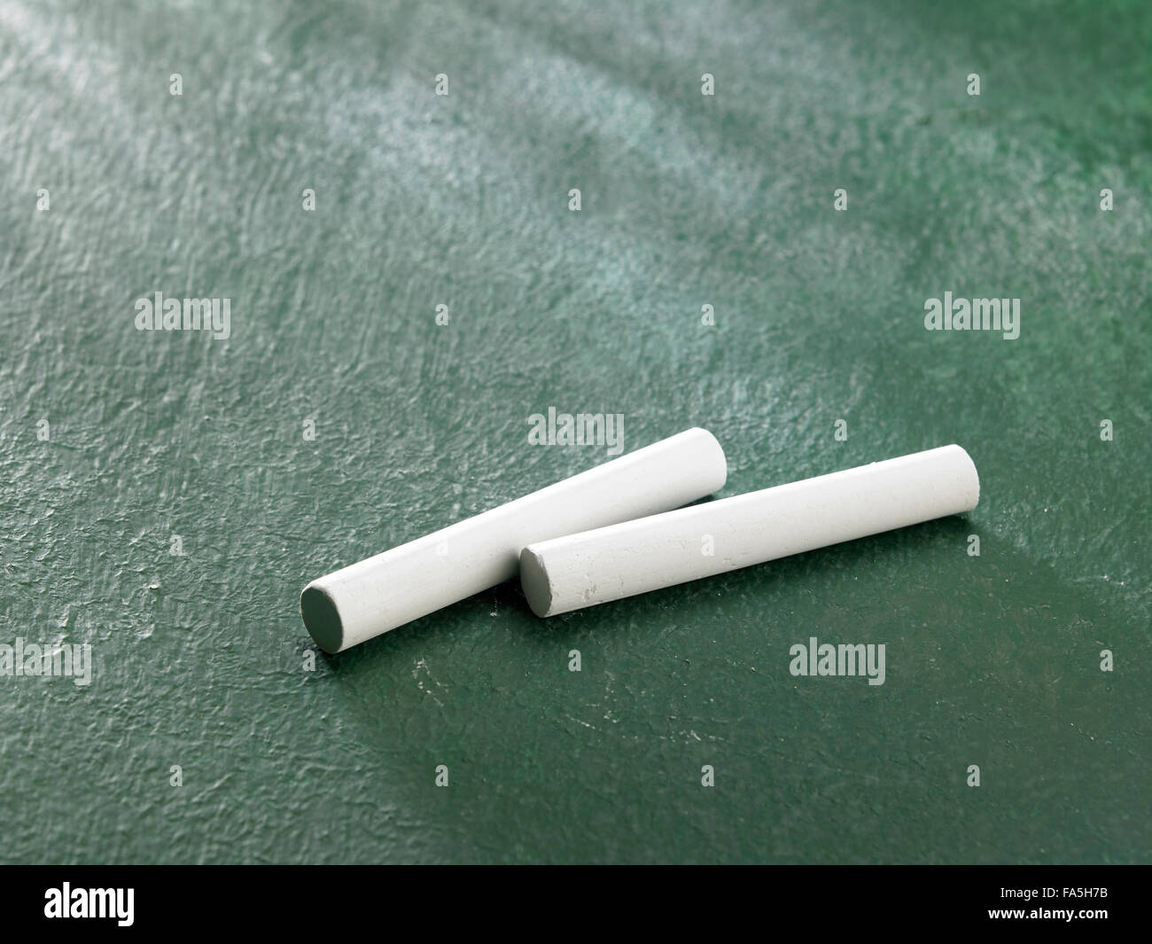 white color chalk on the black board Stock Photo - Alamy