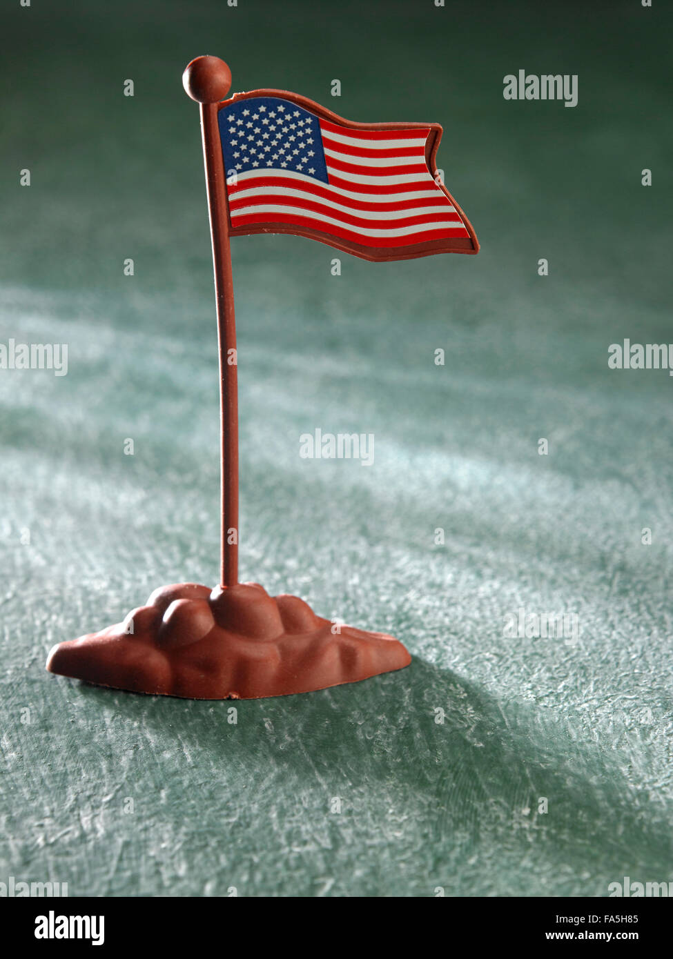 toy America flag on the green background Stock Photo - Alamy