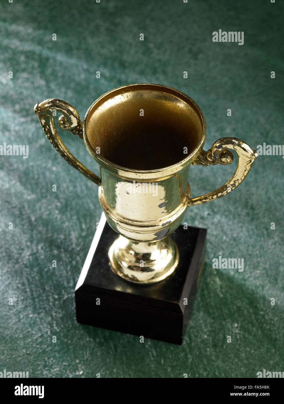 high angle shot of the trophy on the green background Stock Photo - Alamy