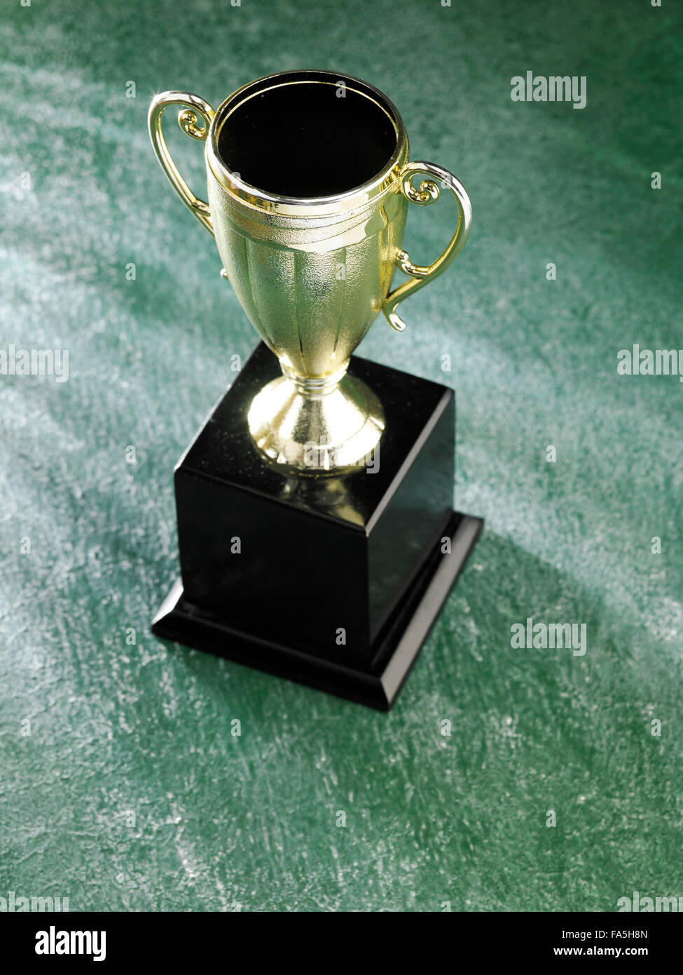 high angle shot of the trophy on the green background Stock Photo - Alamy