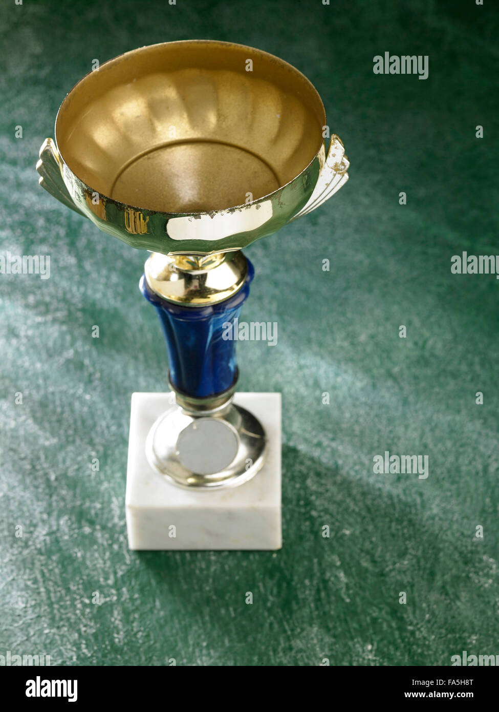 high angle shot of the trophy on the green background Stock Photo - Alamy