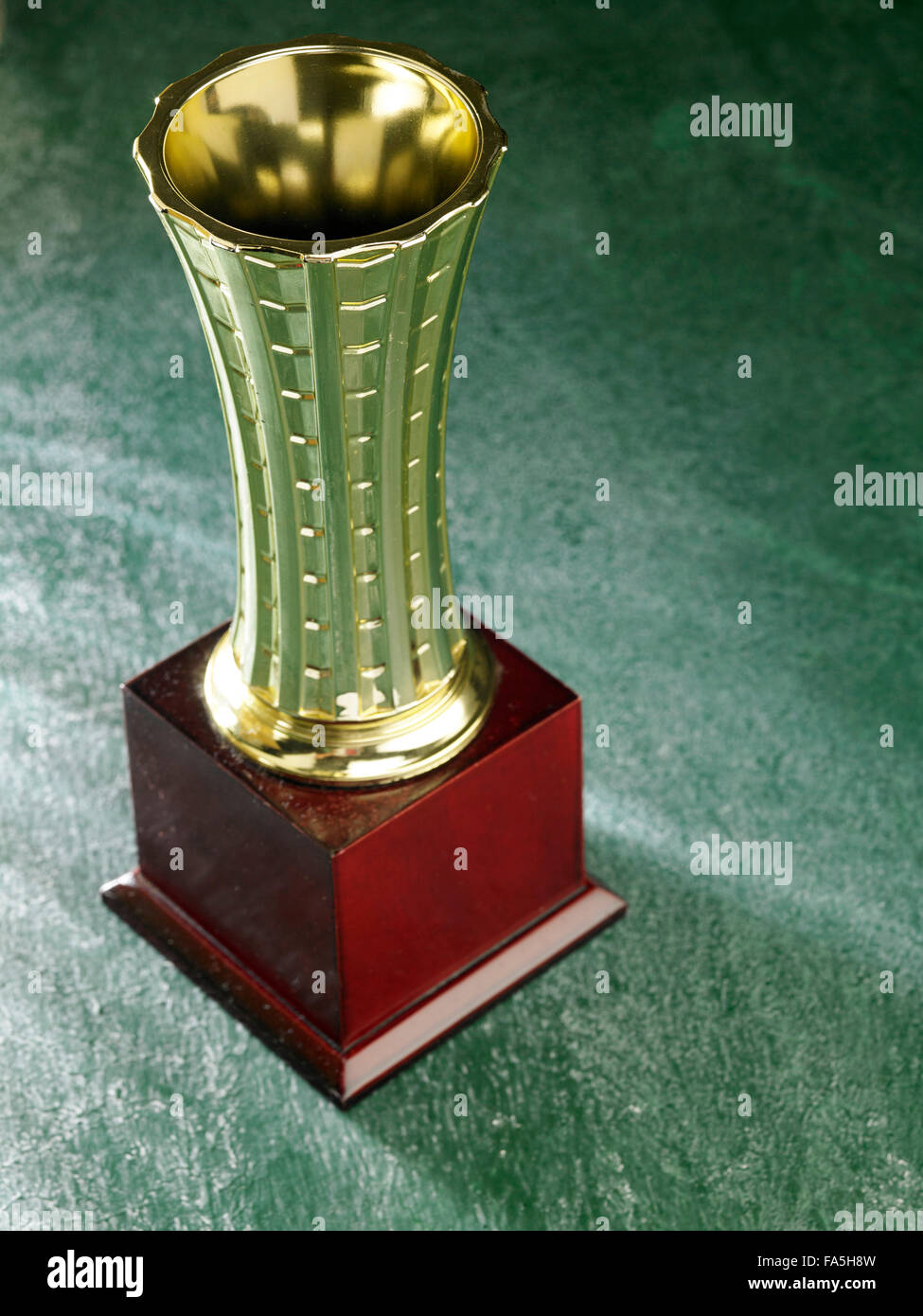 high angle shot of the trophy on the green background Stock Photo - Alamy