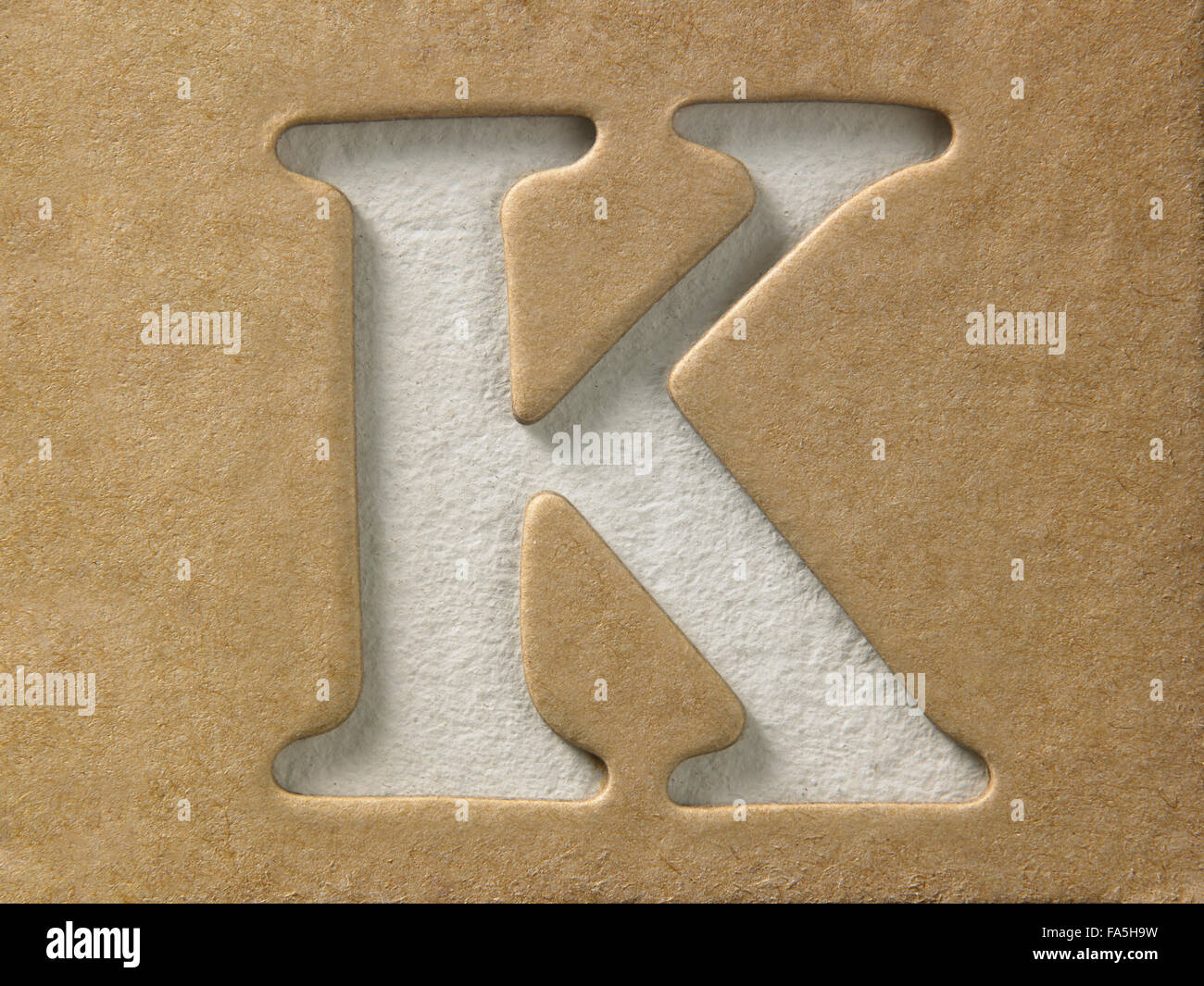 cut out alphabet k on the brown cardboard Stock Photo - Alamy