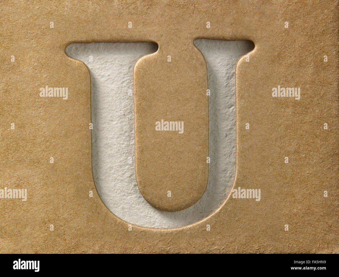 cut out alphabet u on the brown cardboard Stock Photo - Alamy