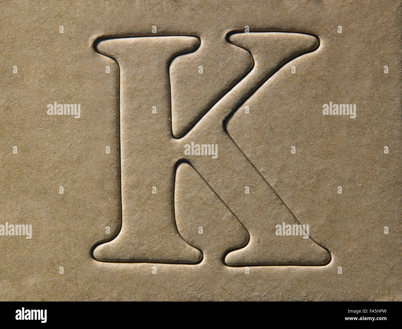 die cut alphabet k on the brown card board Stock Photo - Alamy