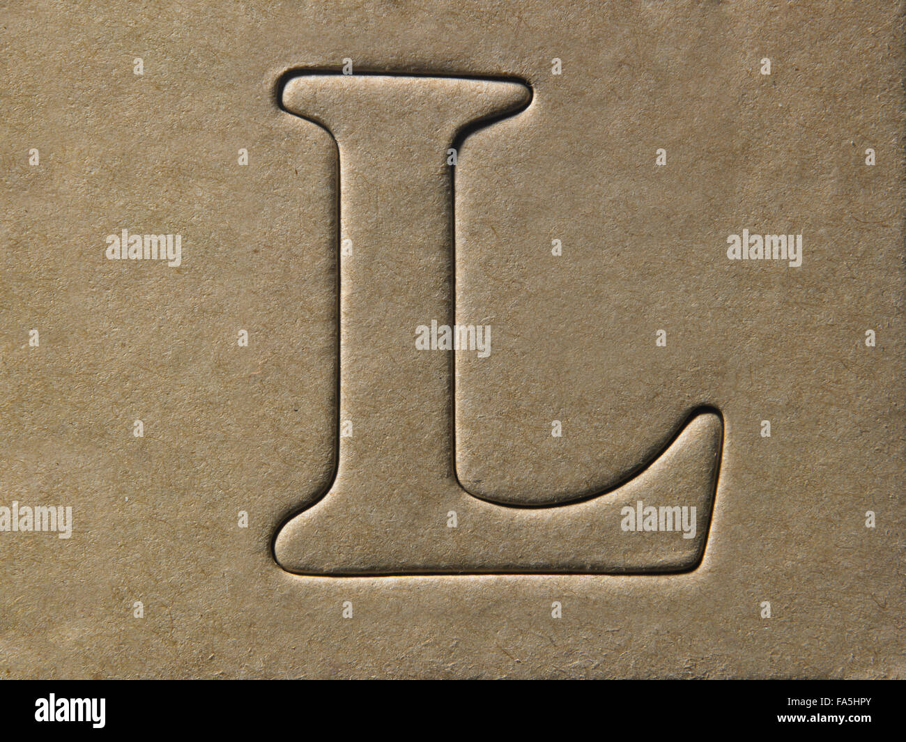 die cut alphabet l on the brown card board Stock Photo - Alamy