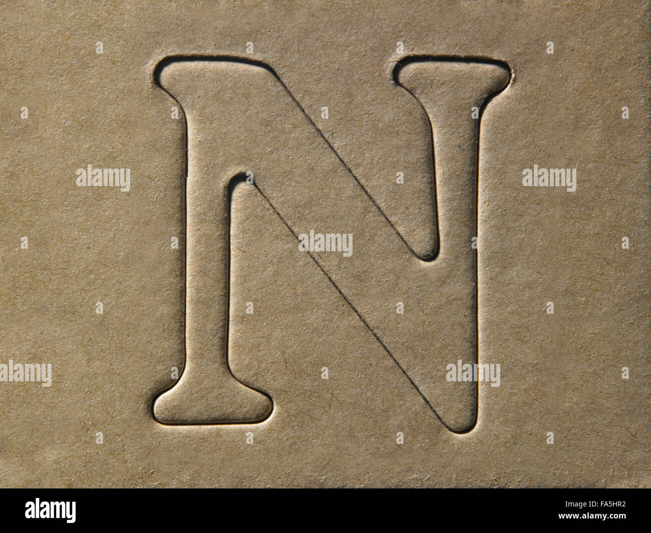 die cut alphabet n on the brown card board Stock Photo - Alamy